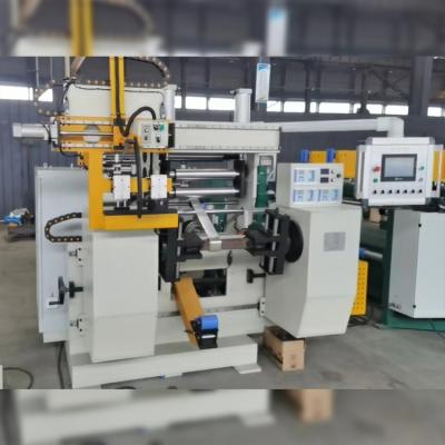 China Two Chucks Automatic Reactor Copper Foil Winding Machine Two Servo Motors Driven for sale