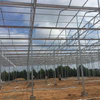 China Green Agricultural Glass Greenhouse with 5mm Covering Span Width 9.6m 10.8m 12m for sale