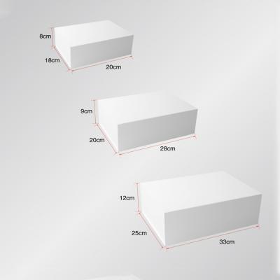 China Luxury Gift Box Packaging Stock Magnet Folding Gift Box With Ribbon for sale