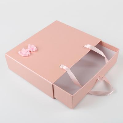 China Custom Pink Fashionable Gift Packaging Box Portable Drawer With Ribbon for sale