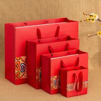 China Custom Design Logo Red Exquisite Special Paper Packaging Bag Shopping Gift Bags With Handle for sale
