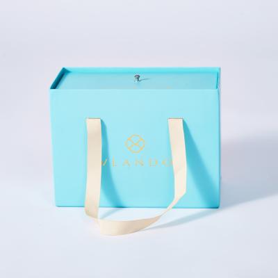 China Luxury Packaging Blue Sliding Drawer Box Customize Bags Gift Box Package With Ribbon Handle for sale
