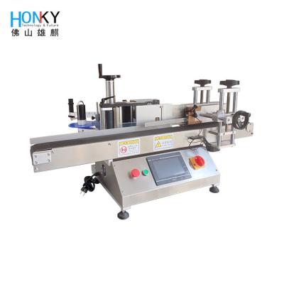 China Desktop Round Bottle Labeling Machine with Transparent Label Sensor and Touch Screen Operation at 55 Bottle per minute for sale