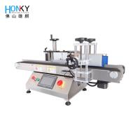 China Desktop Round Bottle Labeling Machine with Transparent Label Sensor and Touch Screen Operation at 55 Bottle per minute for sale