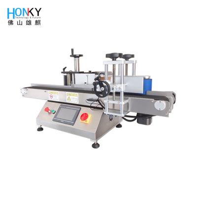 China Desktop Automatic Round Bottle Labeling Machine with 60 Bottle per Minute Speed Touch Screen Control and Stainless Steel Body for sale