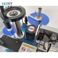 China Desktop Round Bottle Labeling Machine with Transparent Label Sensor and Touch Screen Operation at 55 Bottle per minute for sale