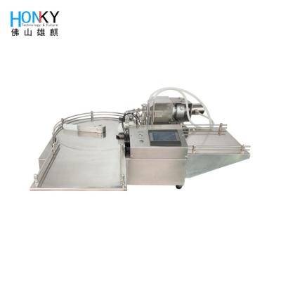 China Desktop 45 BPM Automatic Filling Machine With Round Bottle Feeder and High-Precision Ceramic Pump for sale