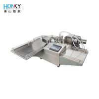 China Desktop 45 BPM Automatic Filling Machine With Round Bottle Feeder and High-Precision Ceramic Pump for sale