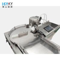 China 30ml Round Bottle Table Top Liquid Filling Machine Semi Automatic with Ceramic Piston Pump and GMP Certification for sale
