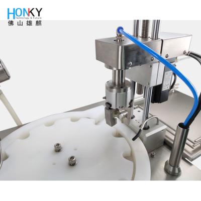 China Desktop Essential Automatic Filling and Capping Machine with XQX2 Ceramic Pump and 304 Stainless Steel for 24 Bottles Per Minute for sale