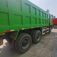China Durable Sinotruk Dump Truck with Hydraulic Steering and Tyres Carbon Steel Cargo Box for sale