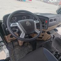 China Sinotruck Trailer Truck with Carbon Steel Cargo Box Material and Air Suspension Seat for sale