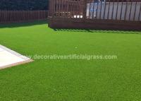 China UV Resistant Artificial Deluxe Synthetic Decorative Grass Lawn With Thick Backing for sale