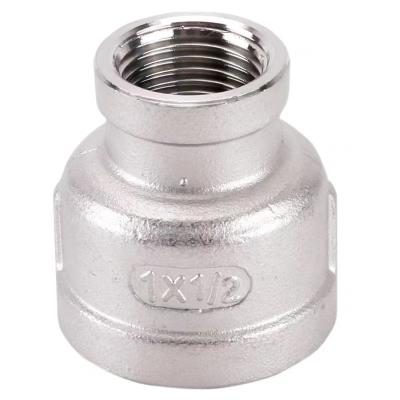 China Stainless Steel 201 304 316 Npt BSP Threaded Pipe Coupling Fittings Red Socket Reducer for sale