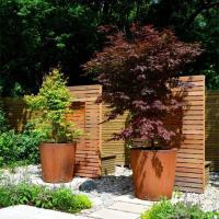 China Luxury Design Large Metal Flower Pots For Home Decor Natural Oxidized for sale