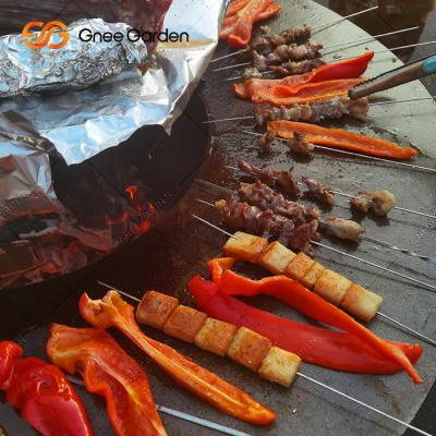 China Outdoor BBQ Corten Steel Fire Pit With Firewood Storage Backyard Rusty Colour for sale