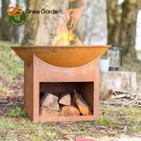 China Round Outdoor Garden Wood Burning Corten Steel Fire Pit 3mm With Wood Storage for sale