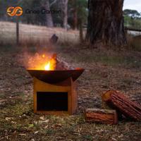 China Round Outdoor Garden Wood Burning Corten Steel Fire Pit 3mm With Wood Storage for sale