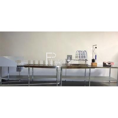 China Semi-Automatic 2L Plastic Mineral Water Bottling Line with 1000BPH Capacity and Adhesive Labeling Machine for sale