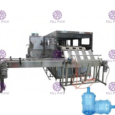 China 600BPH 20 Liter Gallon Bottling Line with 22KW Monoblock Filler and Steam Shrink Machine for sale