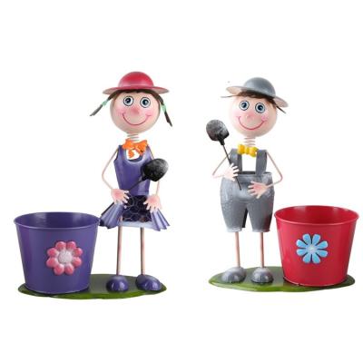 China Metal Pot Garden Planter, Iron Boy Girl Figures Garden Flower Pot for sale