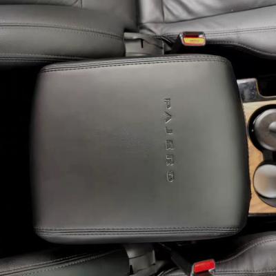 China Mitsubishi Pajero Front Car Interior Kits Armrest Cover Leather Storage Pad Protector KL Brand Auto Accessories Parts for sale