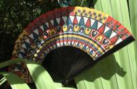 China Spanish Personalised Fancy Cloth Custom Cherry Wood Folding Fan for sale