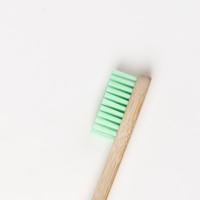 China Round Charcoal Bamboo Handle Toothbrush Stick Spray Paint Silk Screen Logo for sale