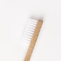 China Round Charcoal Bamboo Handle Toothbrush Stick Spray Paint Silk Screen Logo for sale