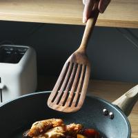 China 33.8cm Teak Solid Kitchen Wooden Utensils Heat Resistant Non Stick Pan Spatula for sale