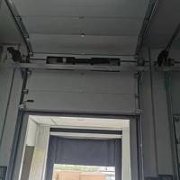 China Custom Vertical Lift Sectional Door Insulated 24dB Overhead Sectional Industrial Doors for sale