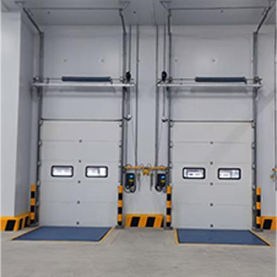 China Custom Vertical Lift Sectional Door Insulated 24dB Overhead Sectional Industrial Doors for sale