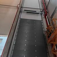 China Weather Sealed Sectional Door Space-Saving Vertical Lift Design For Truck Terminals & Yards for sale