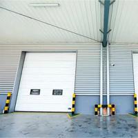China 30000-Cycle Torsion Spring Noise-Reducing Industrial Sectional Overhead Door For Inland Container Depots for sale