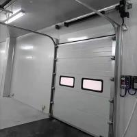 China 380V 220V Safety Industrial Sectional Overhead Door For Internal Facility Traffic Passages for sale