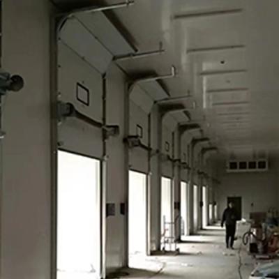 China Space-Saving Vertical Opening Commercial Sectional Door Heavy-Duty Overhead Sectional Door For Raw Material Storage Areas for sale