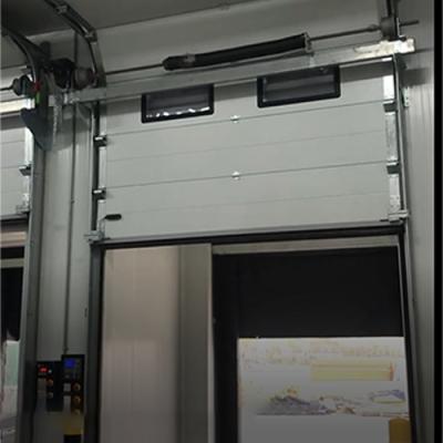 China Strong Panel Construction Heavy Duty Industrial Door For Manufacturing Plant Loading Bays for sale