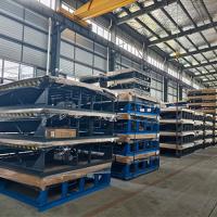 China Hydraulic Loading Dock Leveler 6 Ton Capacity Automotive Parts Warehouse Dock Equipment for sale