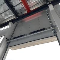 China Automatic Industrial Sectional Overhead Door Windproof With Pedestrian Window For Warehouse Loading Dock for sale