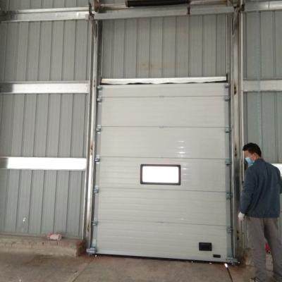 China Excellent Thermal-Insulation Industrial Sectional Overhead Door For General Storage Warehouses for sale