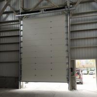 China Excellent Thermal-Insulation Industrial Sectional Overhead Door For General Storage Warehouses for sale