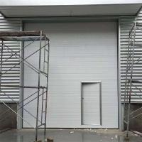 China 0.75-1.5KW Power Industrial Sectional Overhead Door For E-Commerce Fulfillment Centers for sale