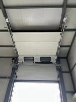 China Flexible Lift Configuration Industrial Sectional Overhead Door for Low-Headroom Building Openings with 24dB Sound Insulation for sale