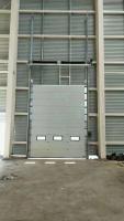China Space-Saving Vertical-Opening Industrial Sectional Overhead Door with Wind Resistance Level 7-8 for Narrow Urban Warehouses for sale