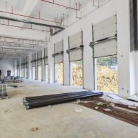 China Space-Saving Vertical-Opening Industrial Sectional Overhead Door with Wind Resistance Level 7-8 for Narrow Urban Warehouses for sale