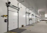 China Flexible Lift Configuration Industrial Sectional Overhead Door for Low-Headroom Building Openings with 24dB Sound Insulation for sale