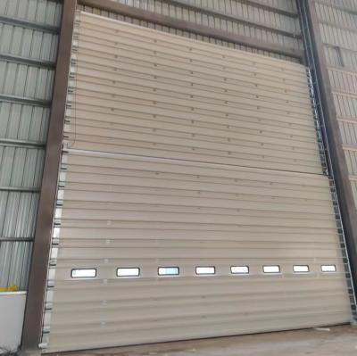 China Flexible Lift Configuration Industrial Sectional Overhead Door for Low-Headroom Building Openings with 24dB Sound Insulation for sale