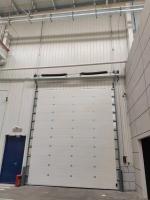 China Thermal Insulated Reinforced Industrial Sectional Overhead Door with 40mm Panel for Factory Main Gates for sale