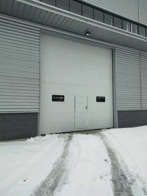 China Integrated Pedestrian Door Industrial Sectional Overhead Door with Wind Resistance Level 7-8 and Sound Insulation 24dB for High-Traffic Warehouses for sale