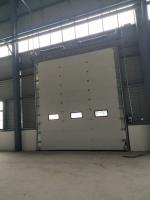 China Thermal Insulated Reinforced Industrial Sectional Overhead Door with 40mm Panel for Factory Main Gates for sale